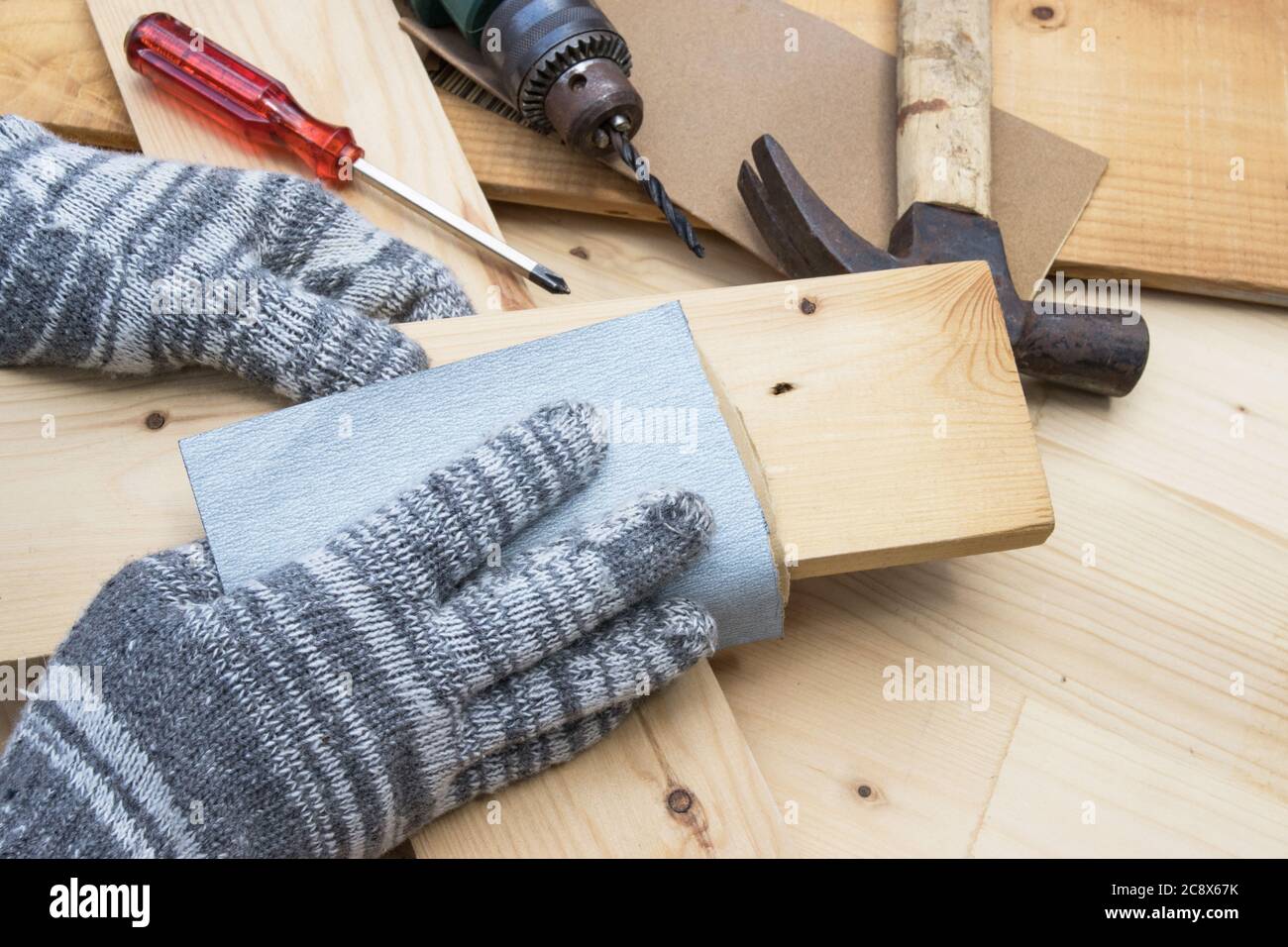 Worker Man Polishing Sandpaper Wood by hand Stock Photo - Alamy