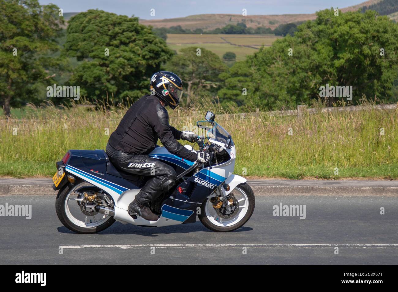 1987 Suzuki 'Full-Floater' system Motorbike rider; two wheeled ...