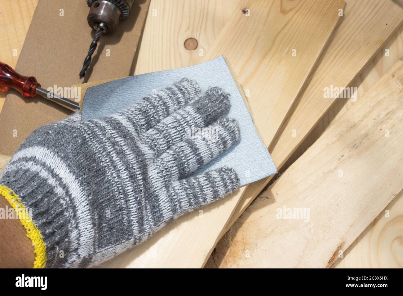 Worker Man Polishing Sandpaper Wood by hand Stock Photo - Alamy