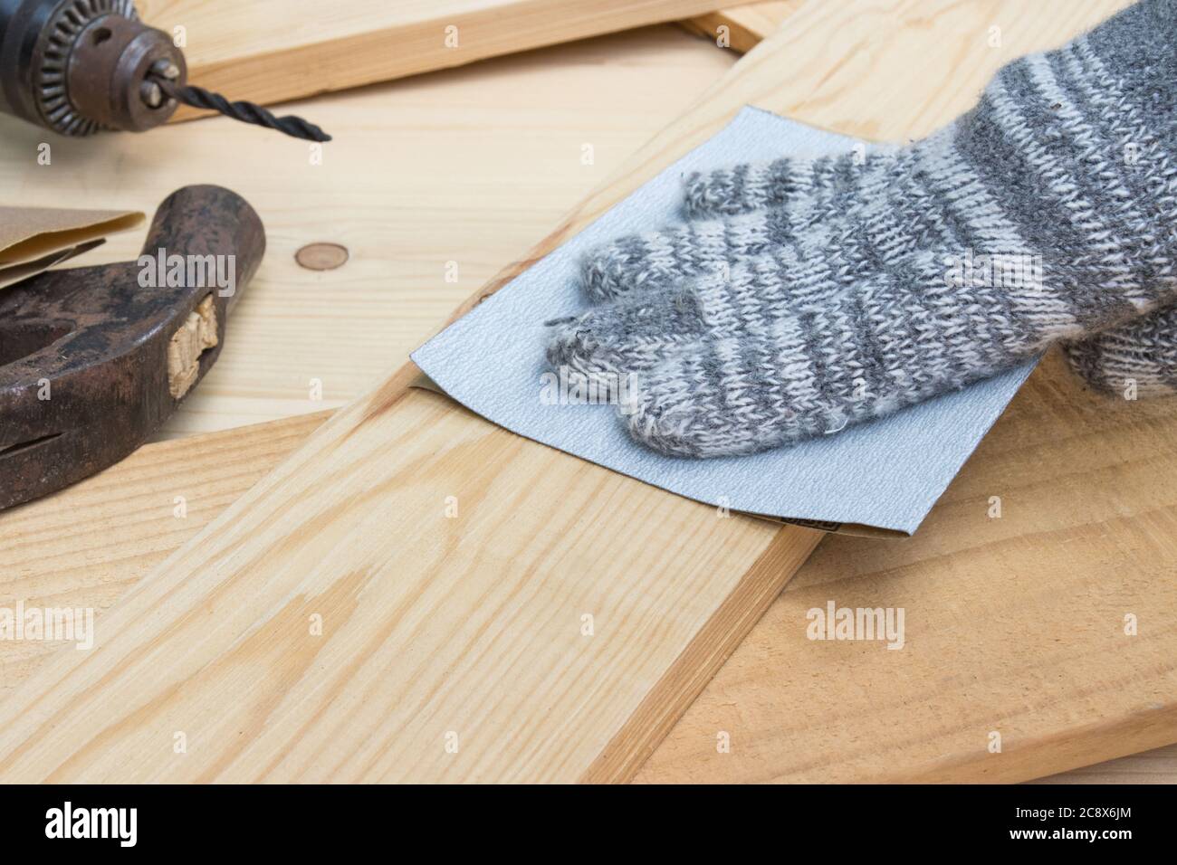 Worker Man Polishing Sandpaper Wood by hand Stock Photo - Alamy