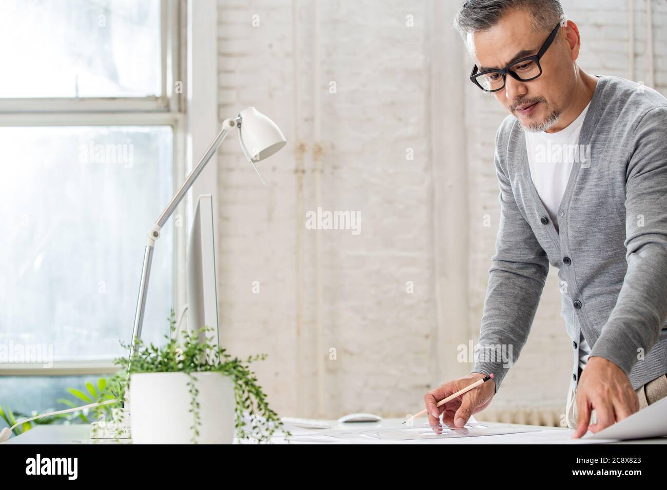 Interior painting drawings of middle-aged and old designer Stock Photo ...