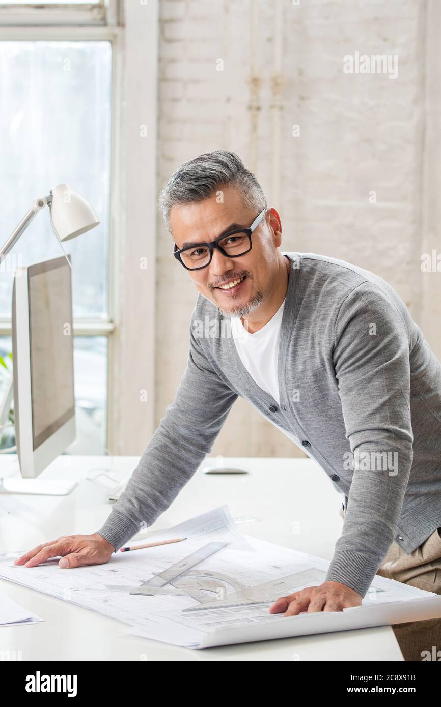 Indoor painting portrait drawing of senior designers Stock Photo - Alamy