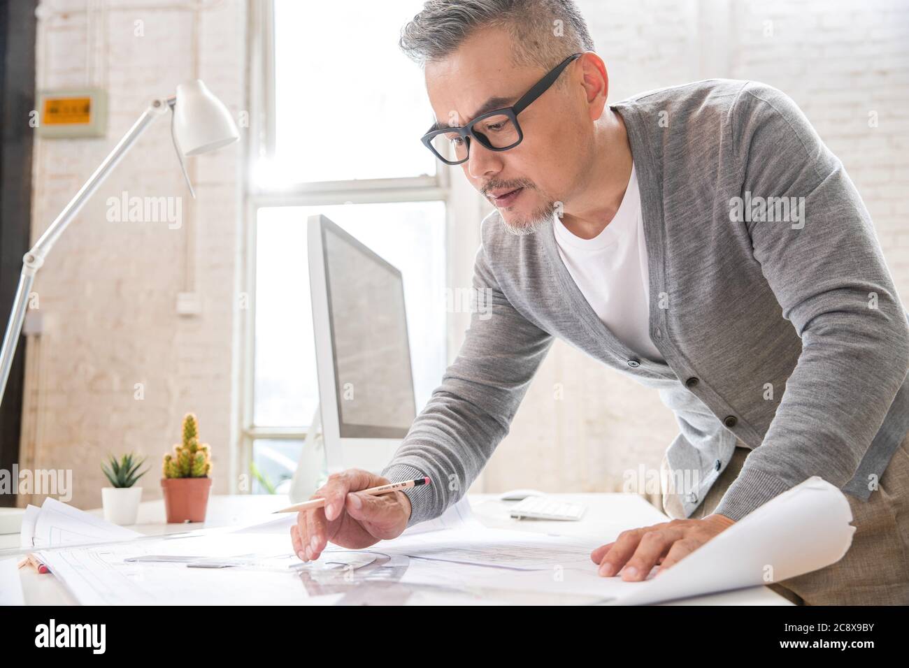 Interior painting drawings, a senior designer Stock Photo - Alamy