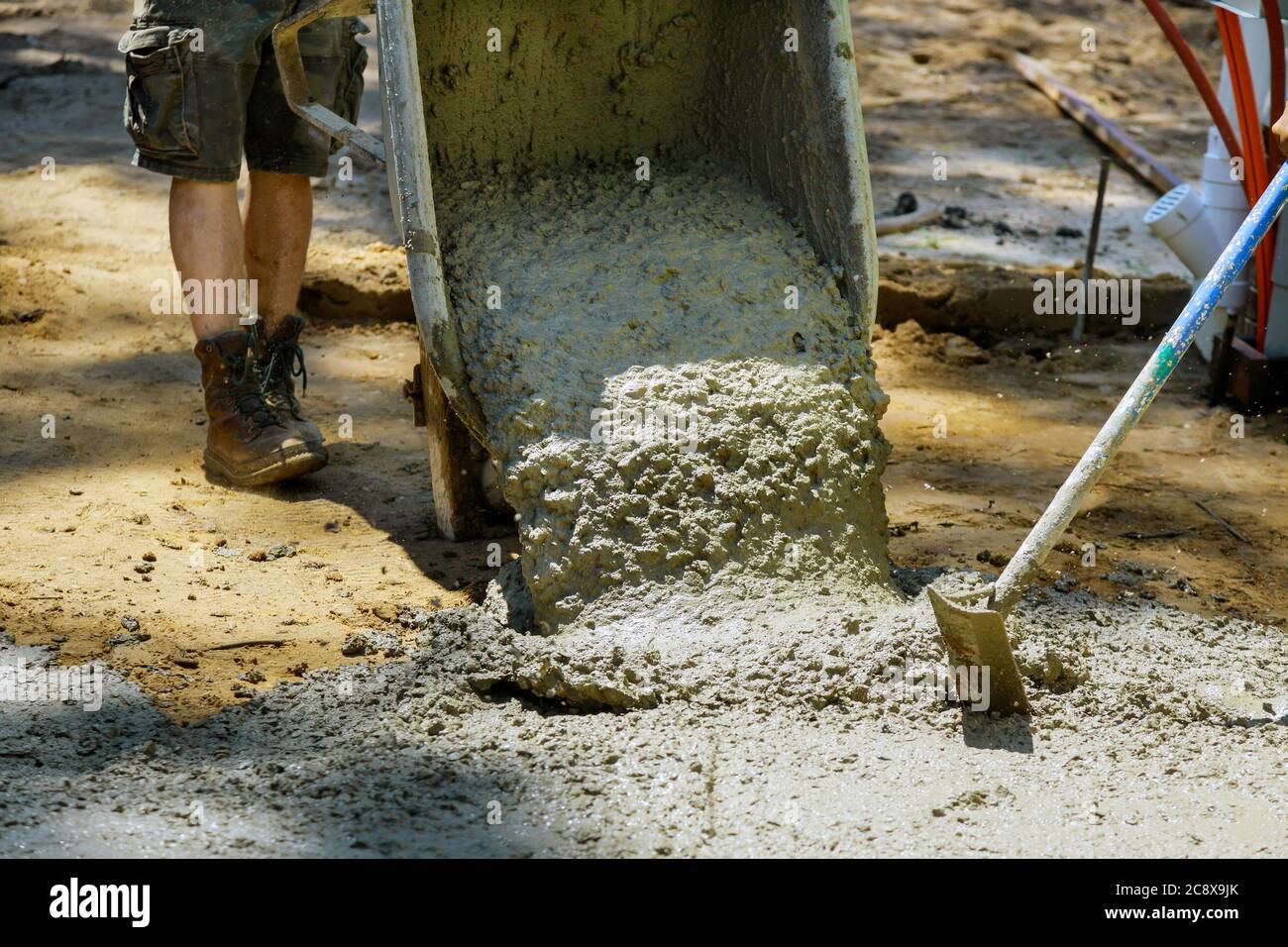 Construction filling formwork with cement worker pour cement for ...
