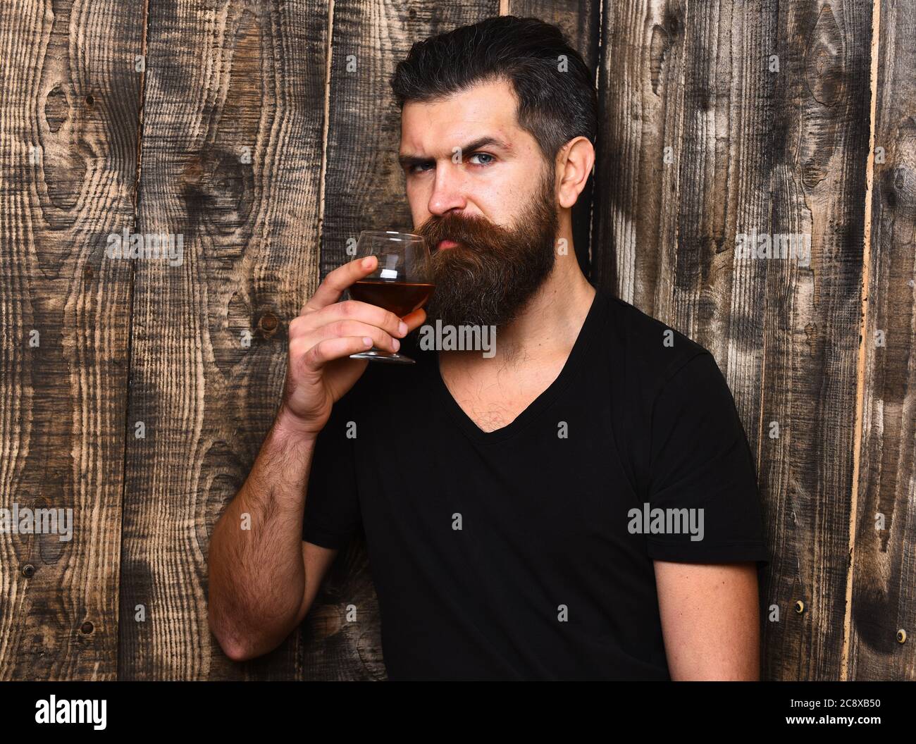 Service and restaurant drinks concept. Man with beard and mustache ...