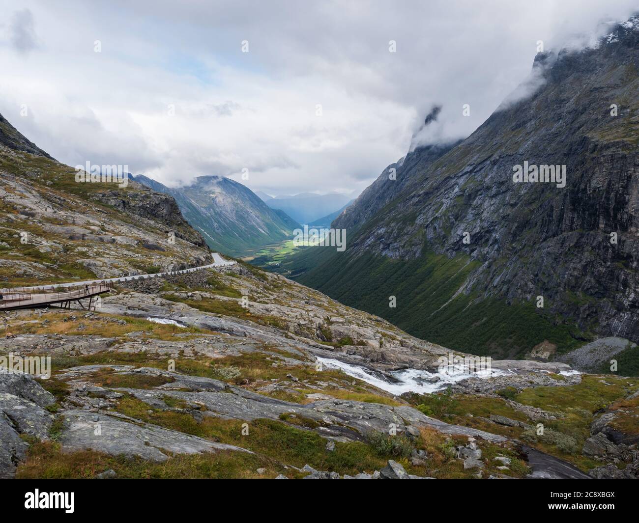 View point platform on Trollstigen or Trolls Path with green valley and ...