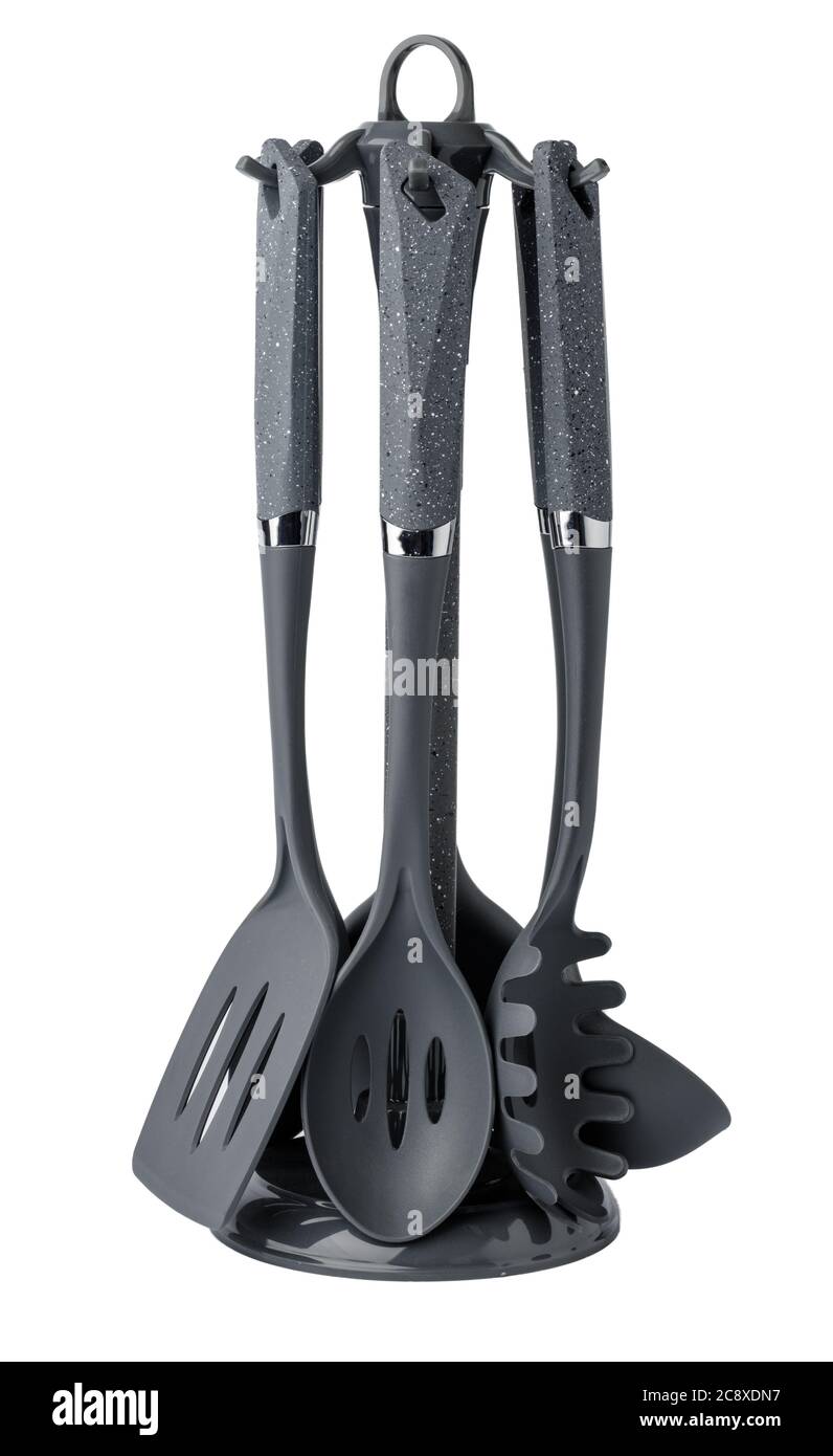 Stand with set of kitchen utensils on white background Stock Photo - Alamy