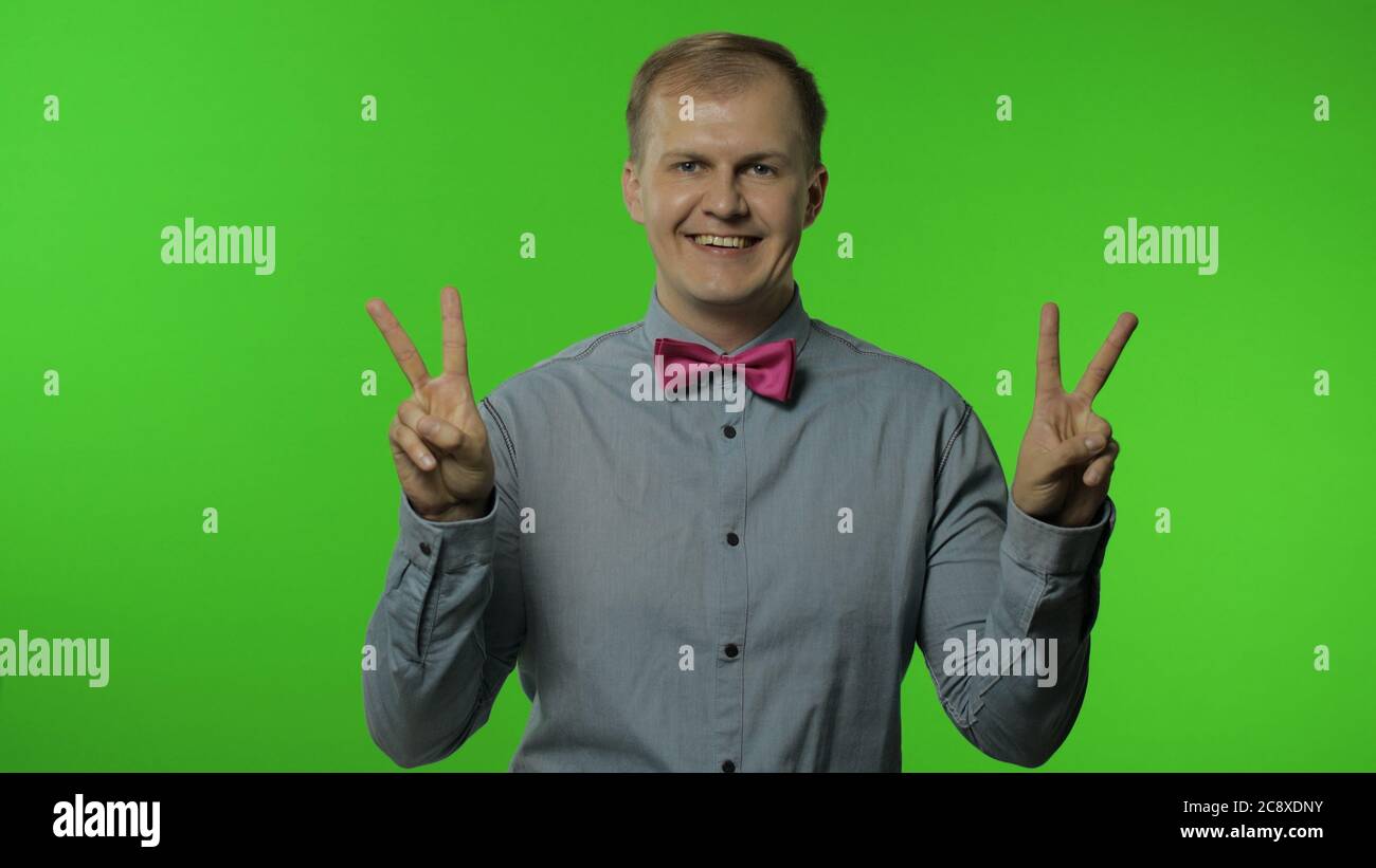 Man doing peace sign hi-res stock photography and images - Alamy