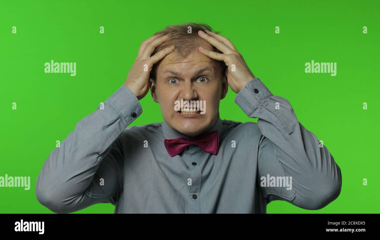 Man feeling crazy, stressed out, irritated about troubles, raising ...