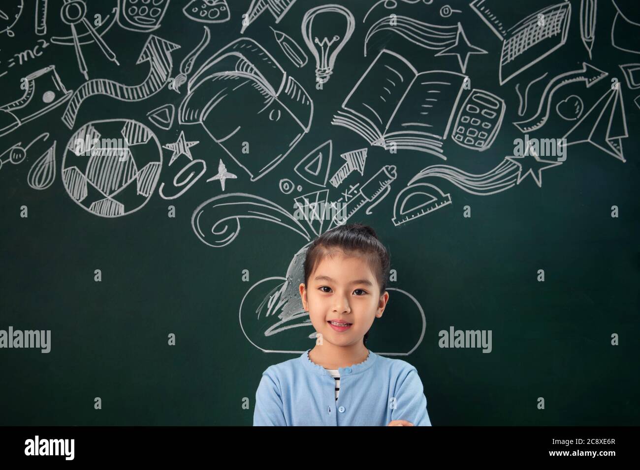 Standing in front of the blackboard primary school girls Stock Photo ...