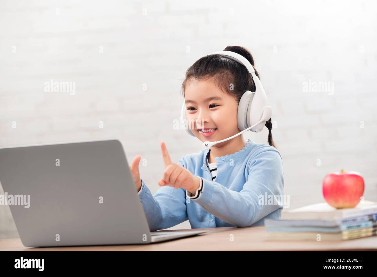 Primary school girls online learning Stock Photo - Alamy