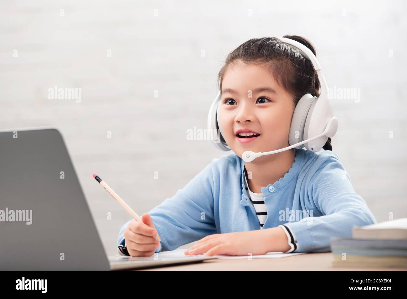 Primary school girls online learning Stock Photo - Alamy