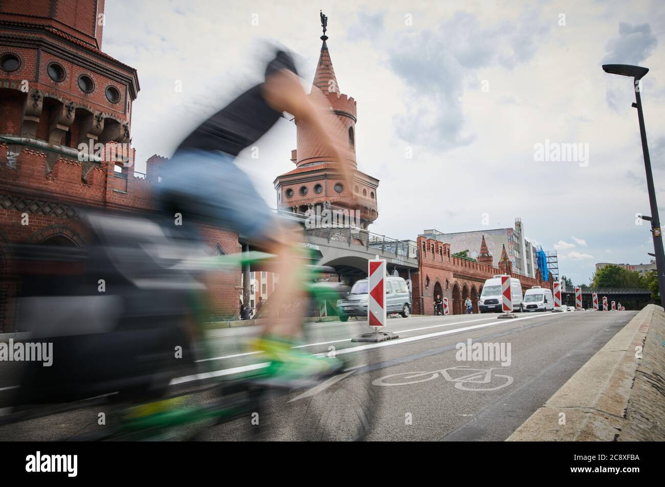 Berlin, Germany. 27th July, 2020. A cyclist rides on the widened cycle ...