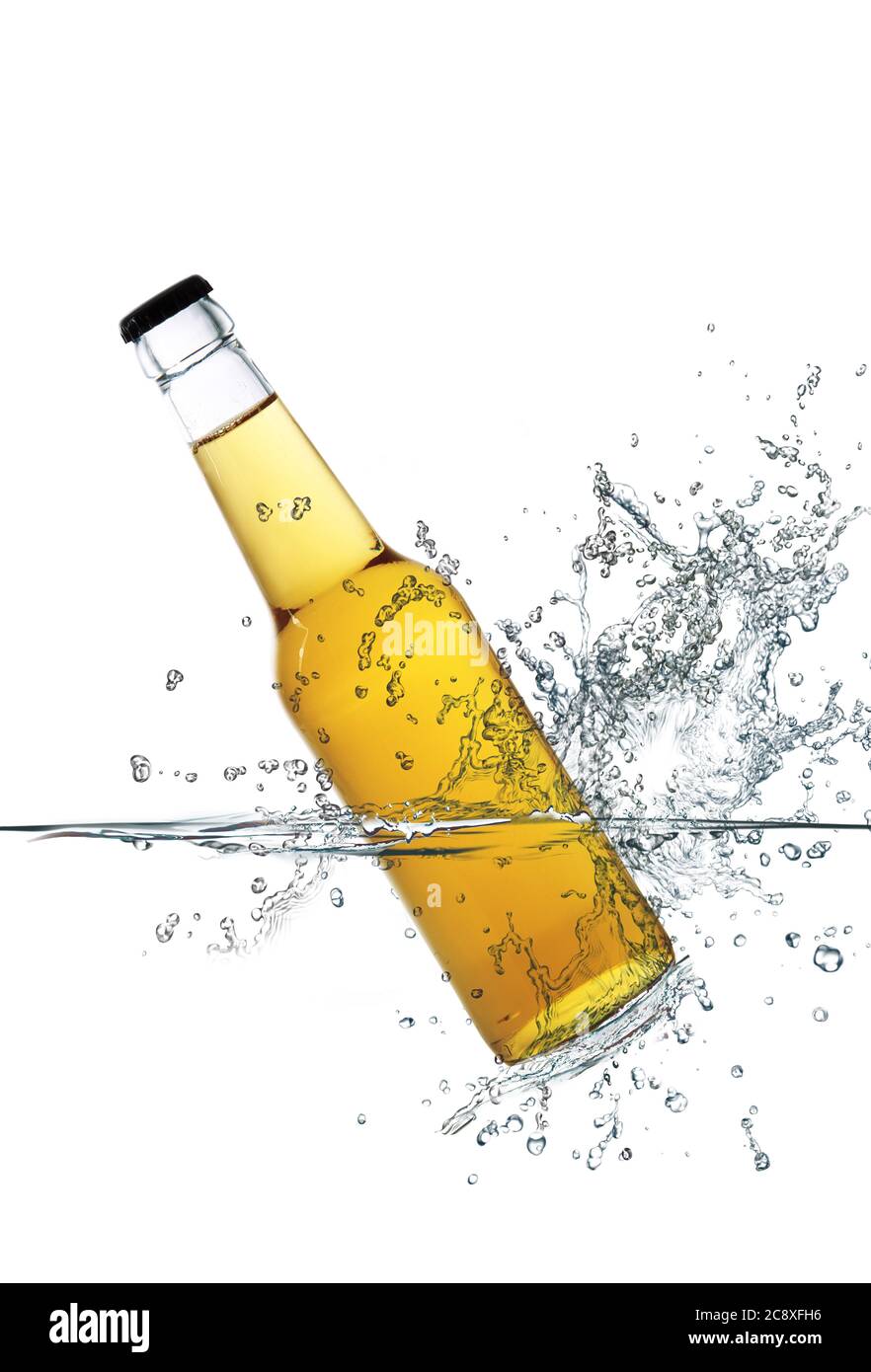 yellow glass bottle falling in water Stock Photo - Alamy