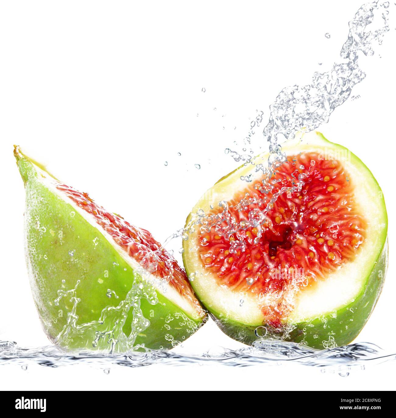 fresh fig falling in water Stock Photo - Alamy