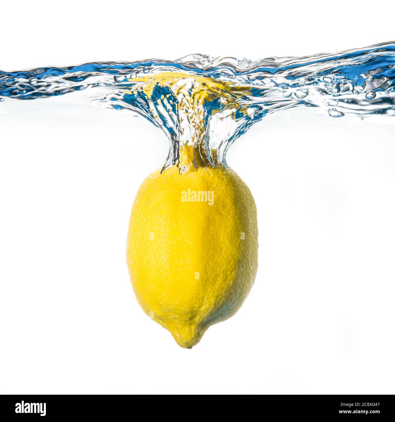 fresh lemon falling in water Stock Photo - Alamy