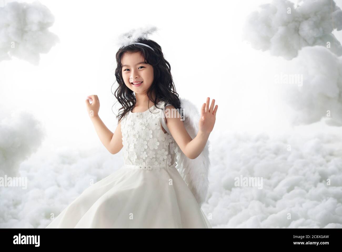 Playful angel hi-res stock photography and images - Alamy