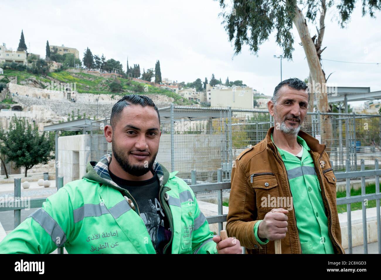 Workers standing next to The Roman Theatre in Amman, Jordan Stock Photo ...