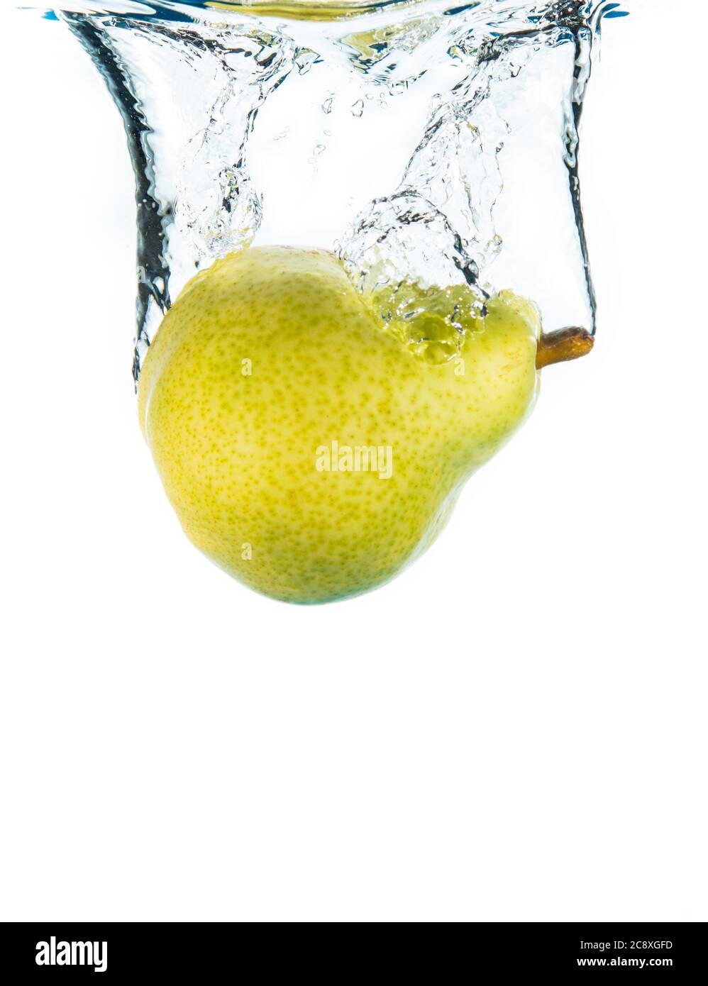 fresh pear falling in water Stock Photo - Alamy