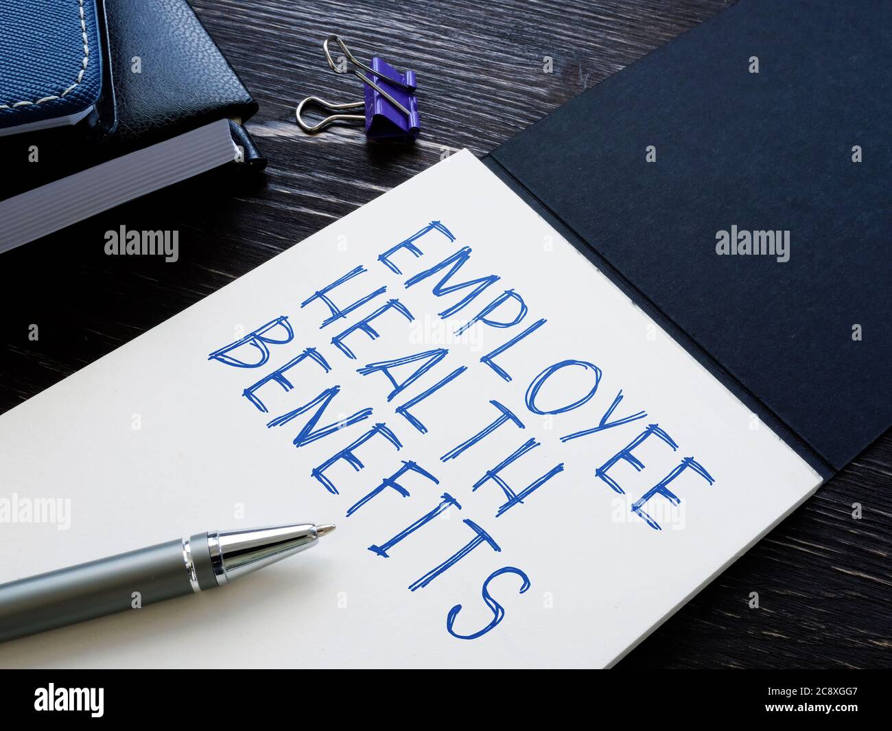 Employee Health Benefits the inscription on the page of the notebook ...