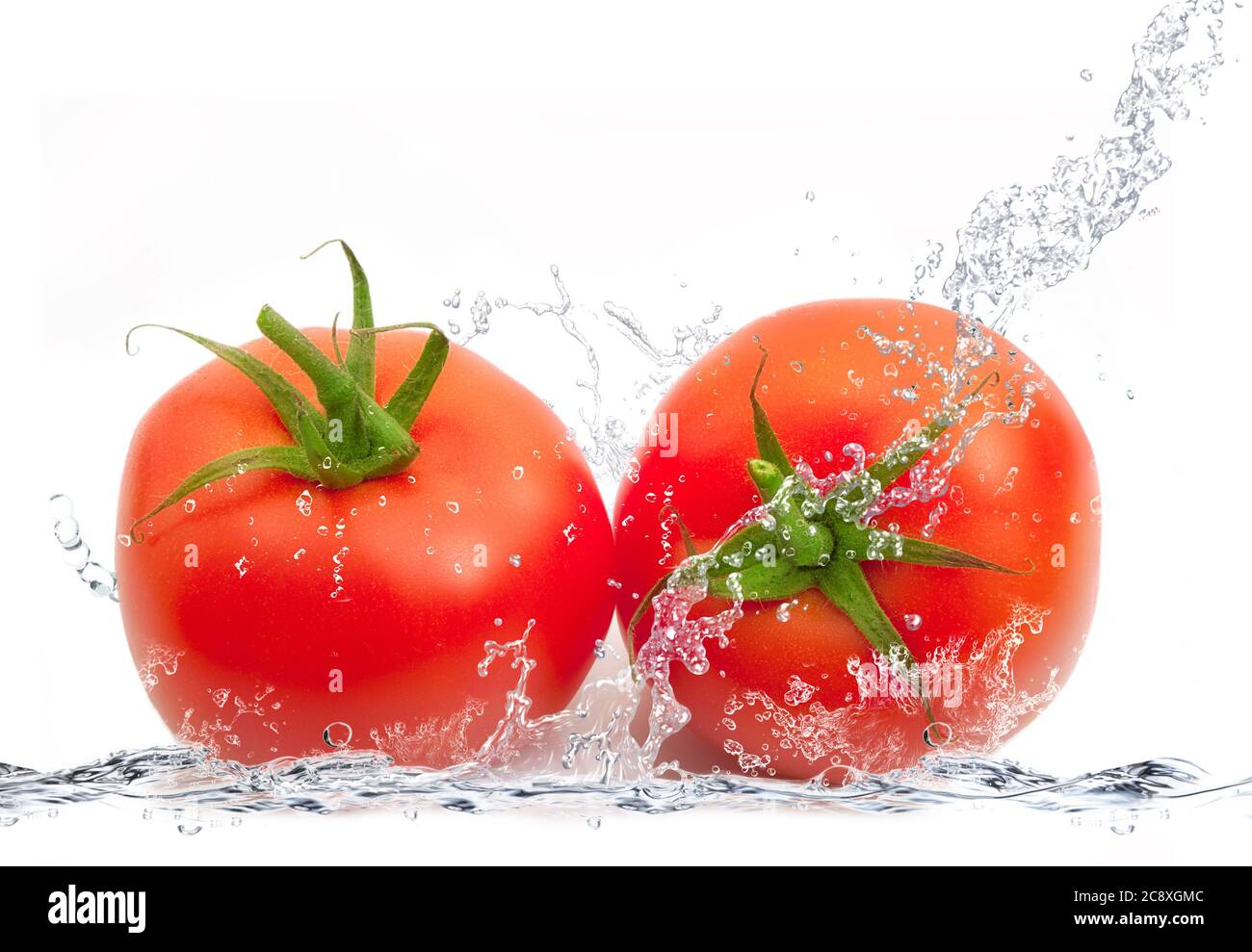 fresh tomatoes falling in pure water Stock Photo - Alamy