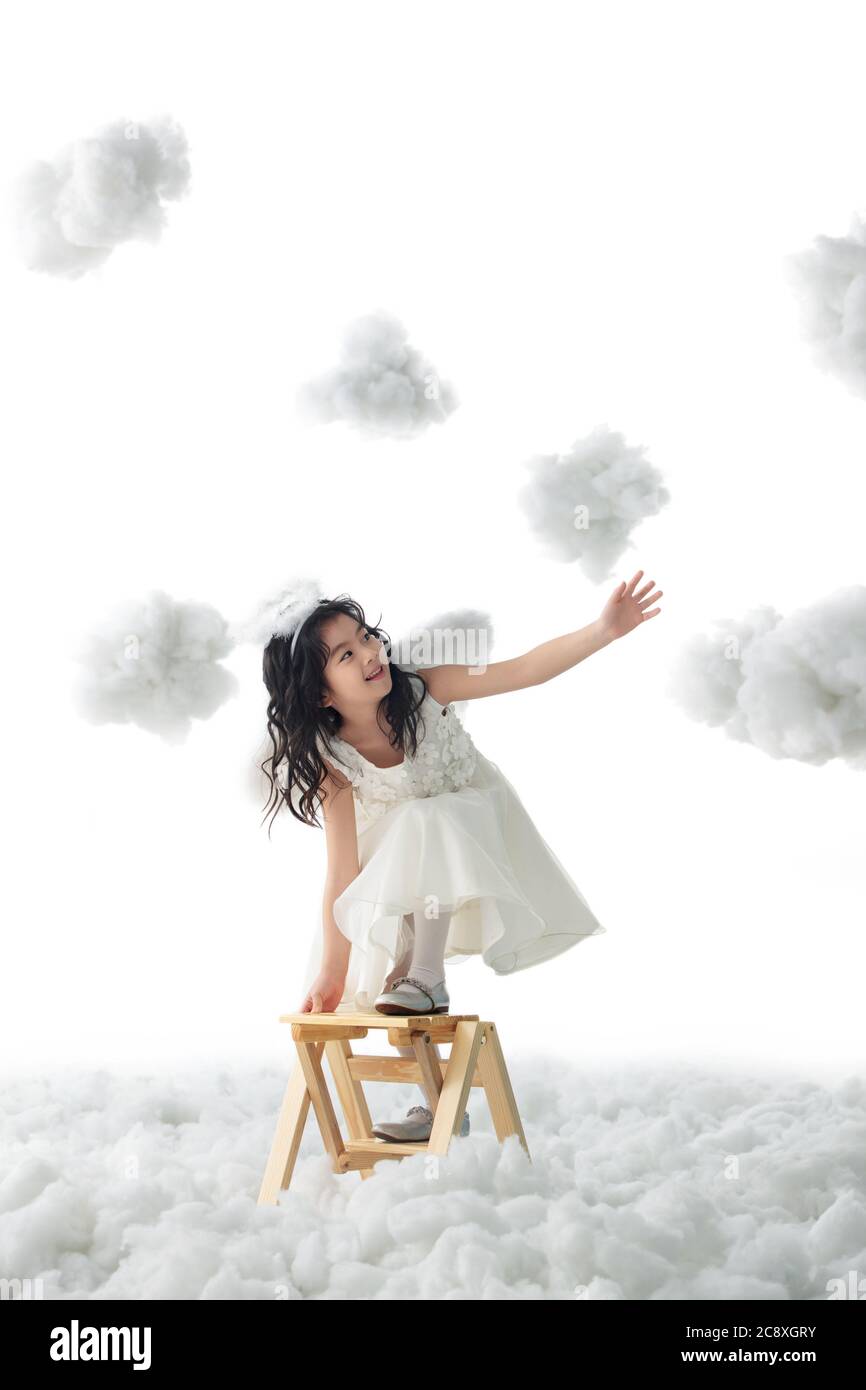 Climb up the ladder play little angel Stock Photo - Alamy