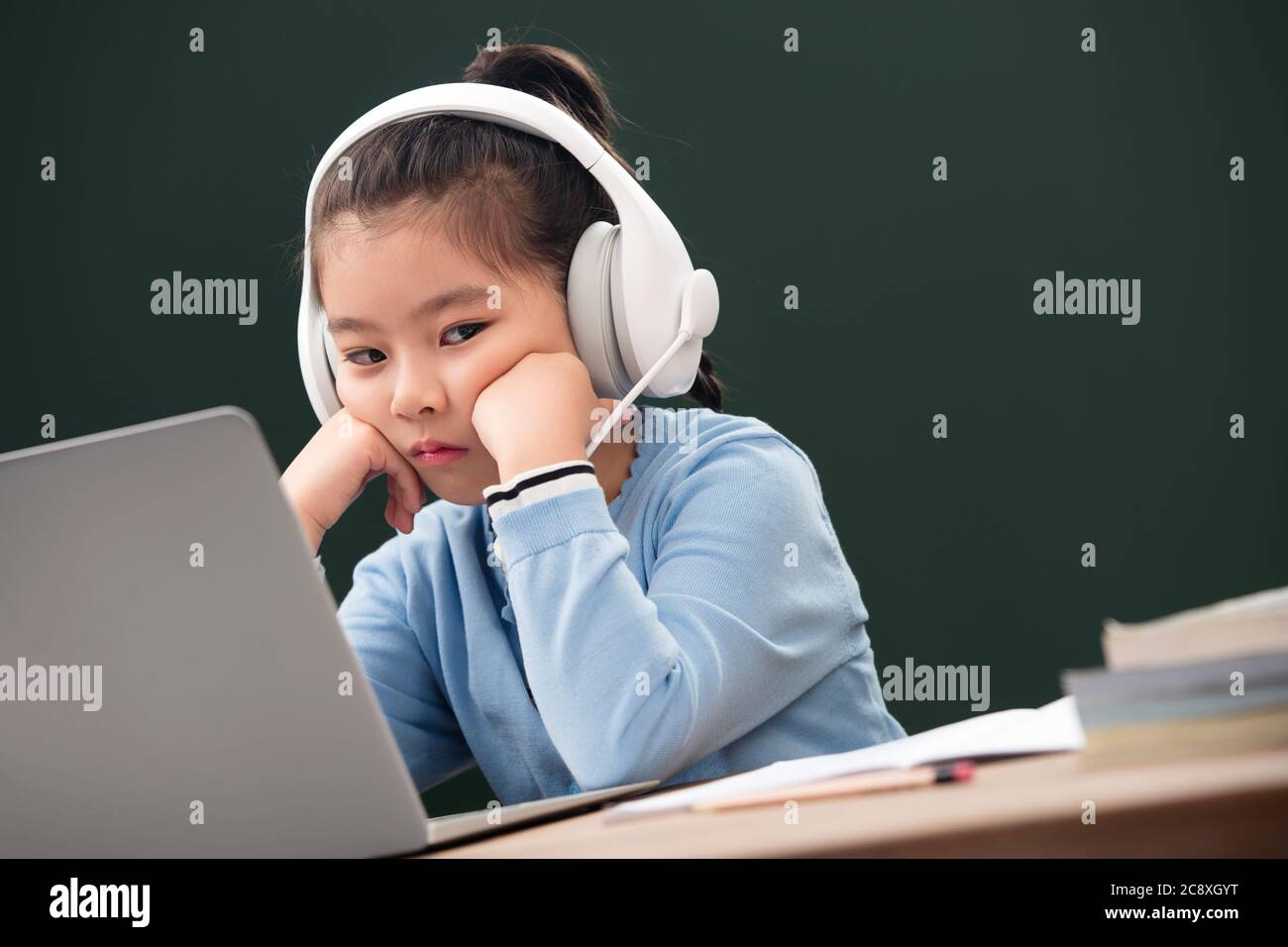 Primary school girls online learning Stock Photo - Alamy