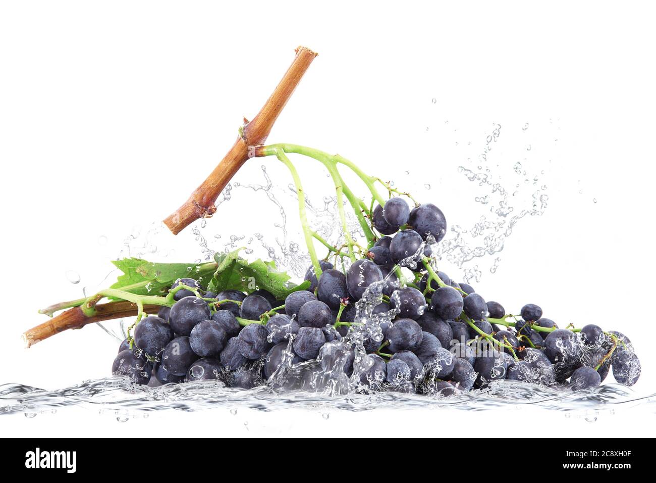 fresh grapes falling in water Stock Photo - Alamy