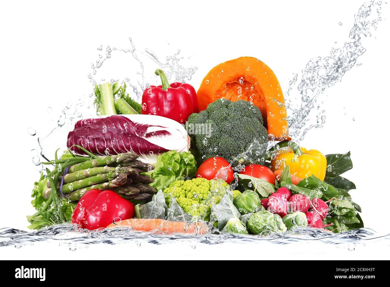 many fresh vegetables falling in water Stock Photo - Alamy