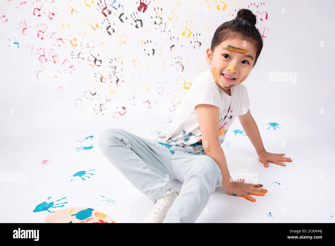 The little girl hand painted paints Stock Photo - Alamy