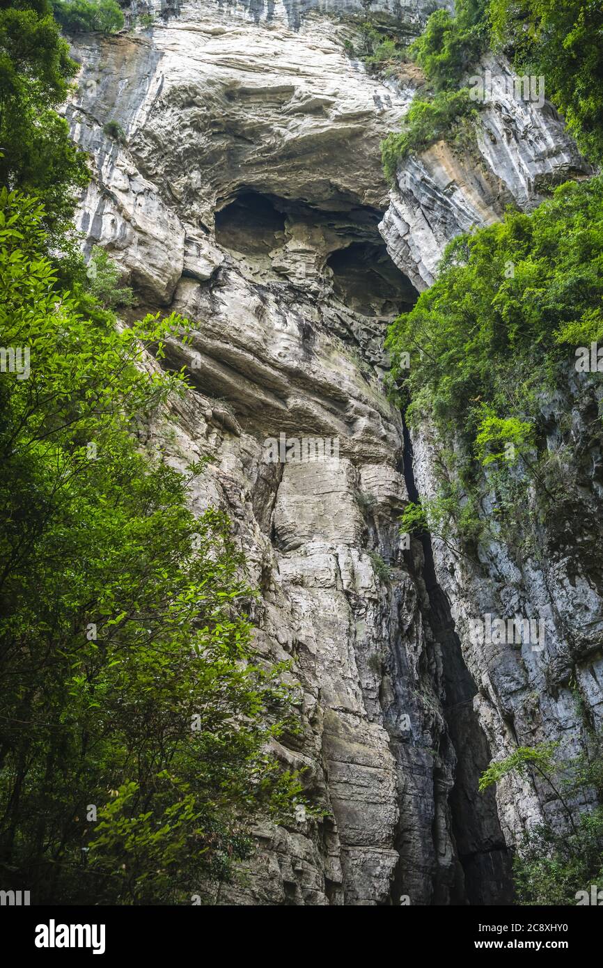 Cliffside holes and fissures resembling human eyes, nose and mouth and ...