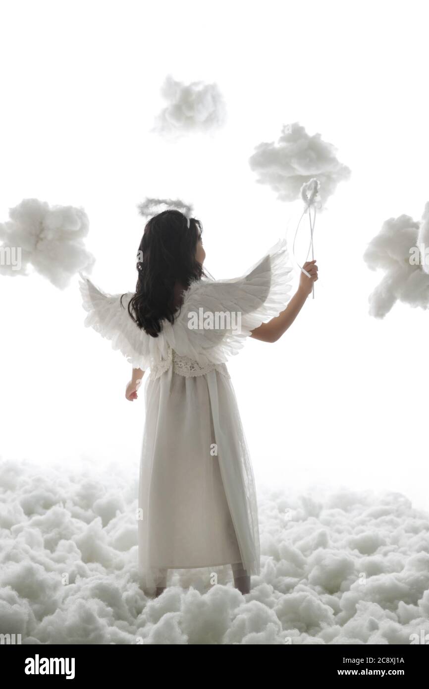 Holding a magic wand angel figure Stock Photo - Alamy