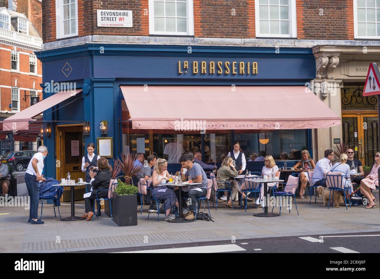 People dining al fresco at pavement tables at La Brasseria Milanese ...