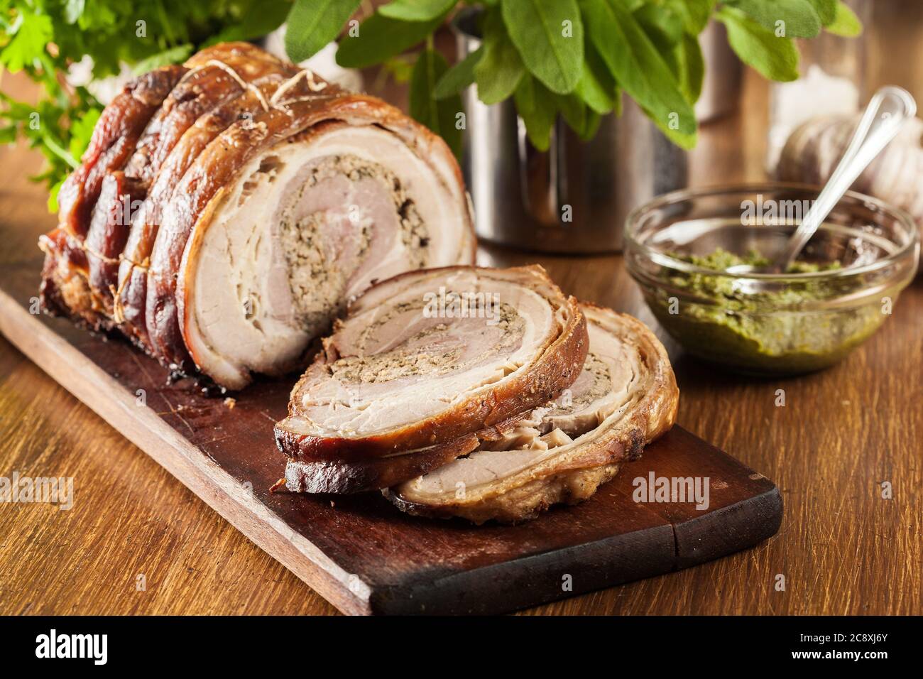 Traditional italian porchetta. Rolled pork belly stuffed with mincemeat ...
