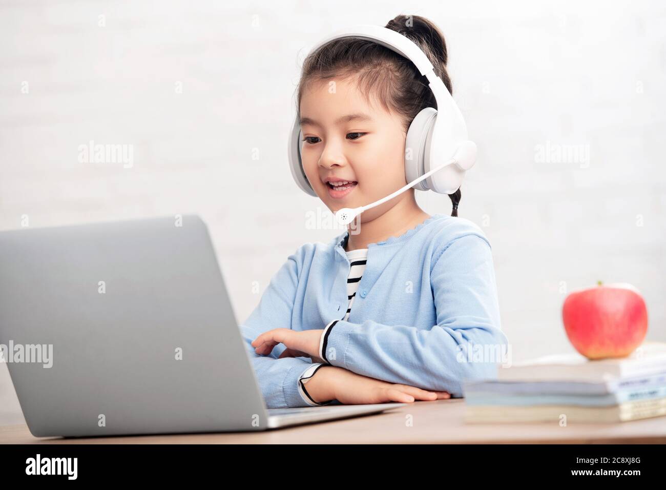 Primary school girls online learning Stock Photo - Alamy