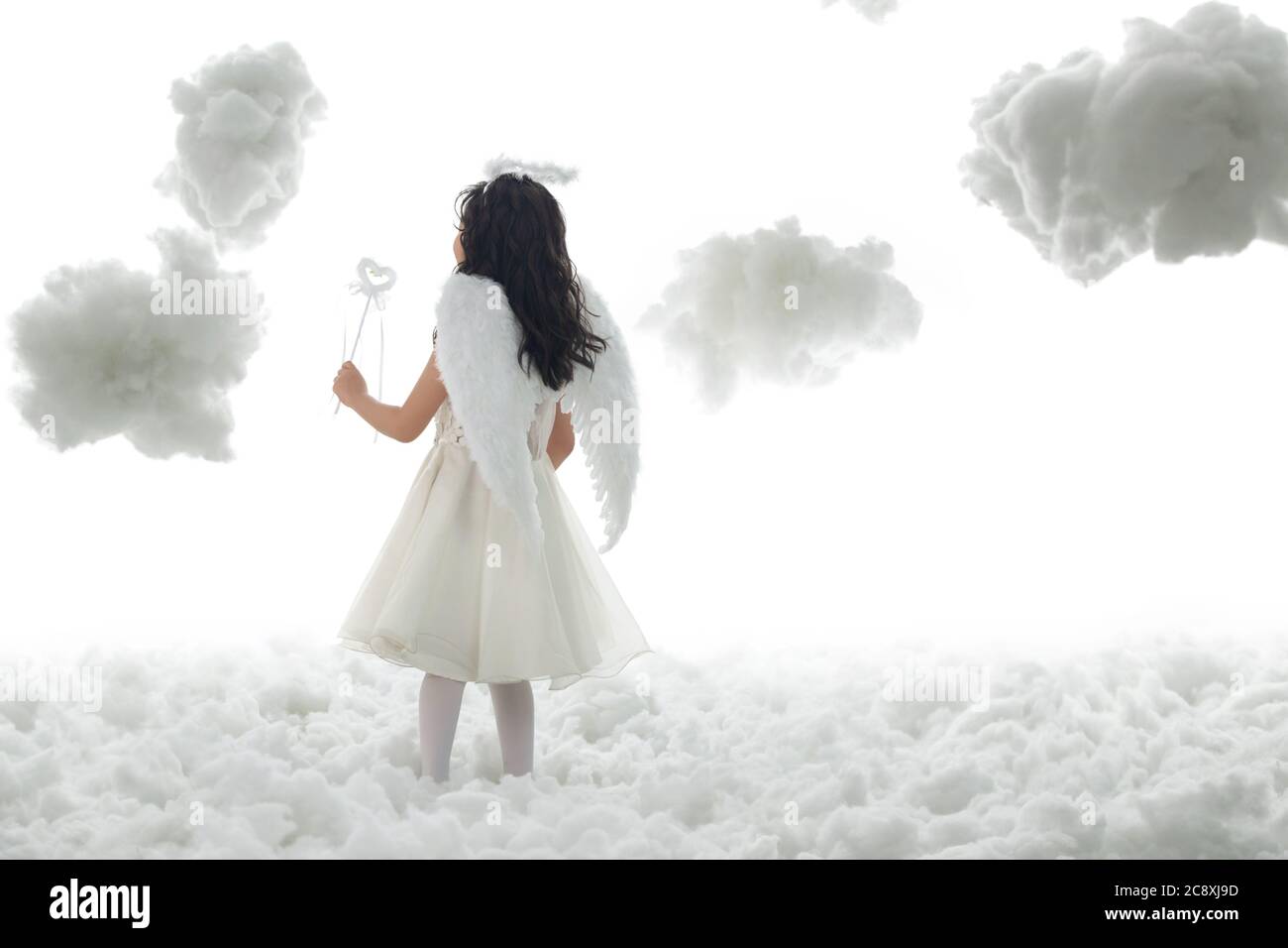 Holding a magic wand angel figure Stock Photo - Alamy