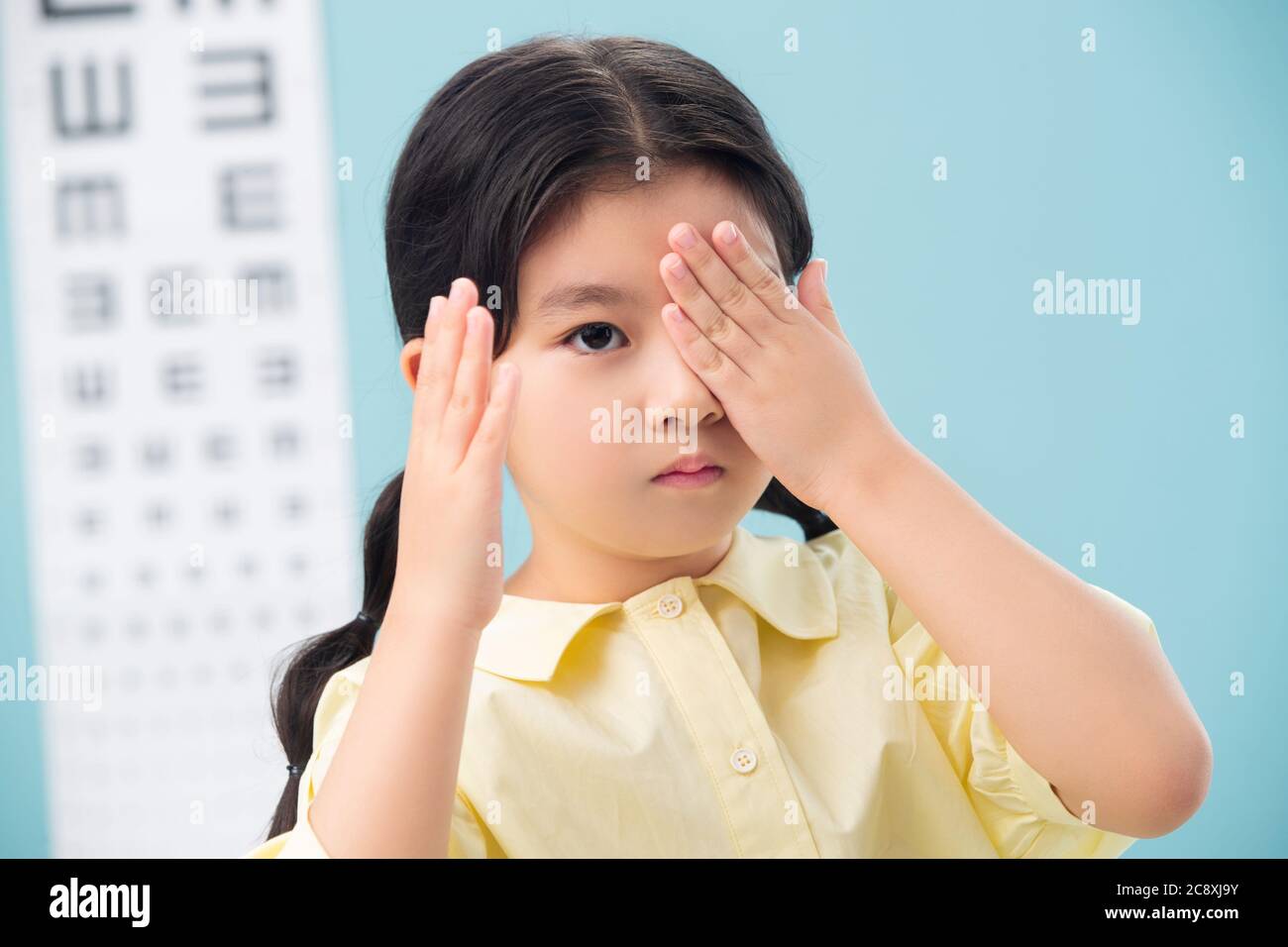 The little girl eye test Stock Photo - Alamy
