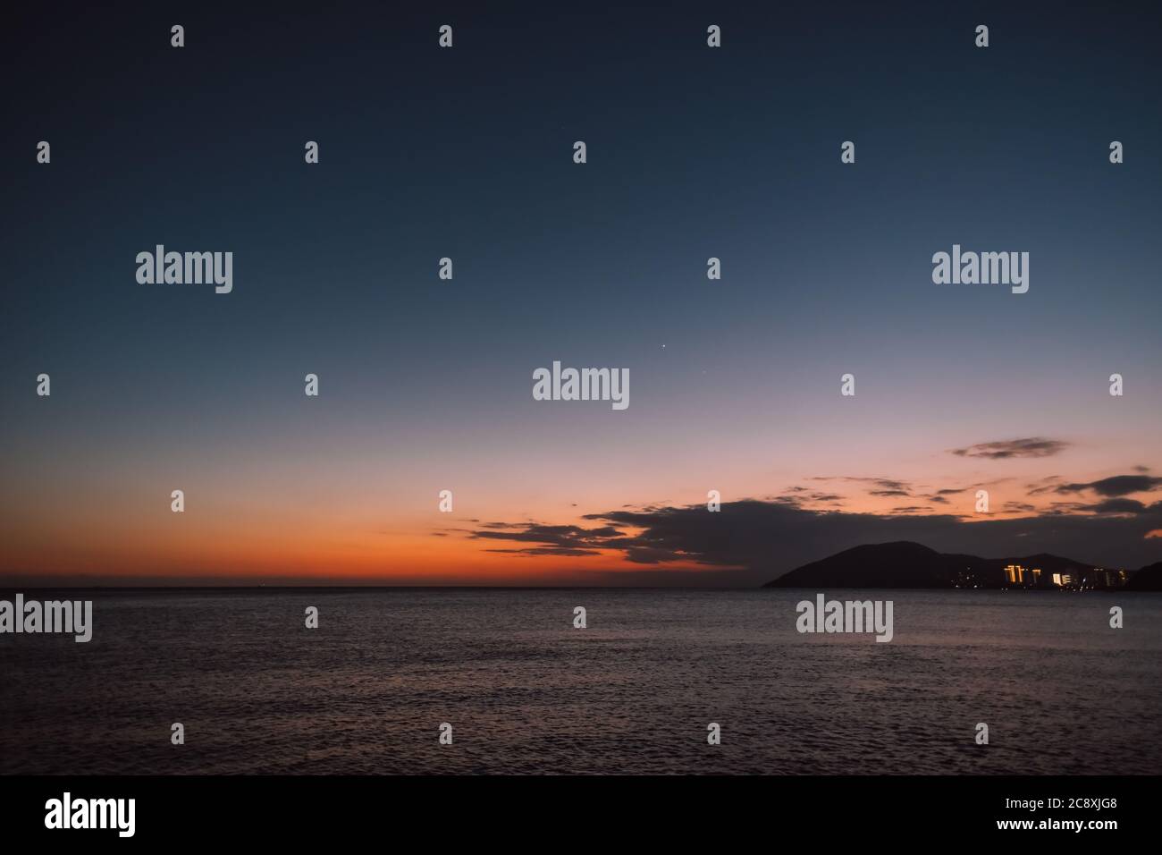 Beautiful sunset on a tropical island at the sea beach Stock Photo - Alamy