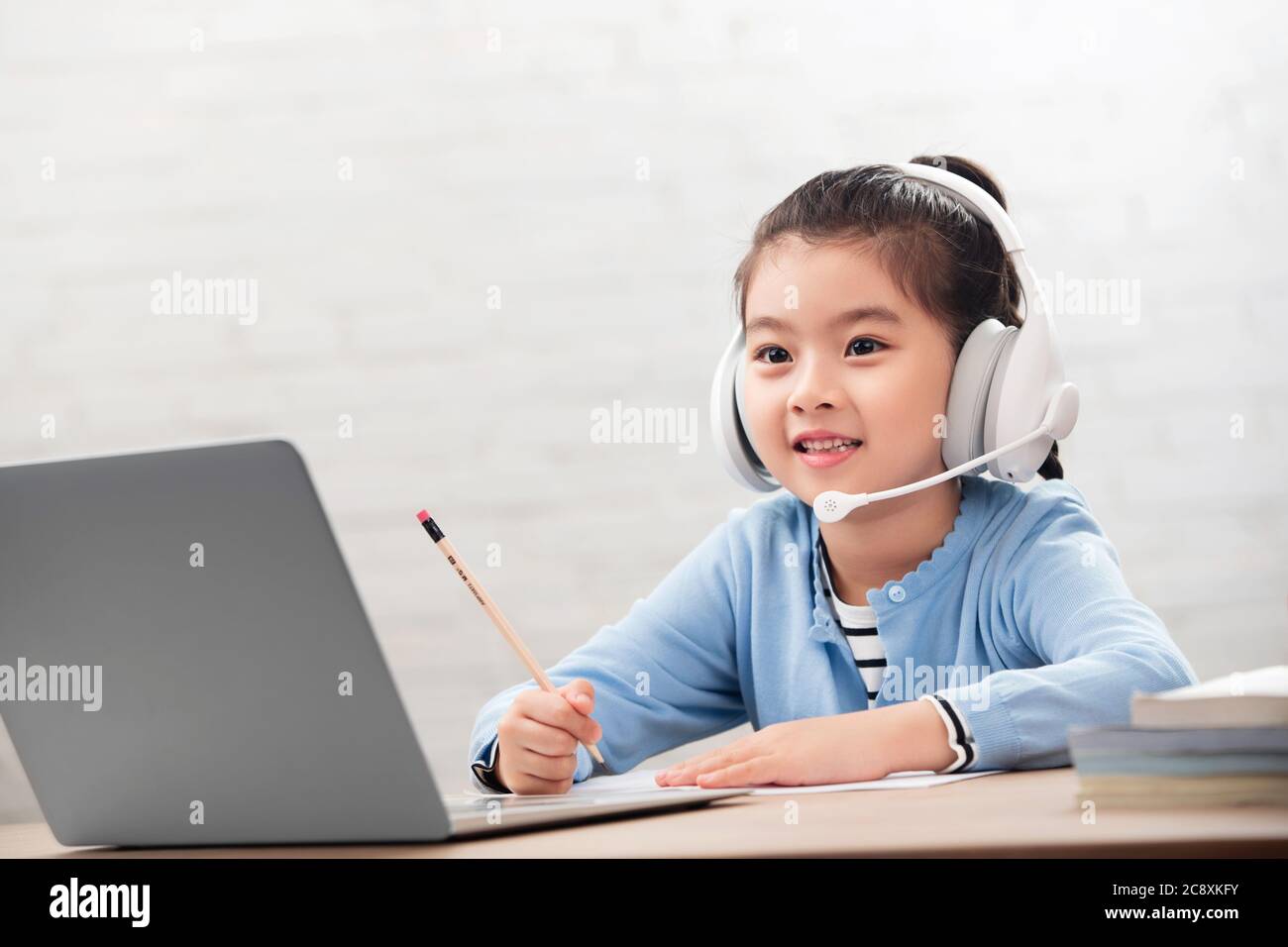Primary school girls online learning Stock Photo - Alamy