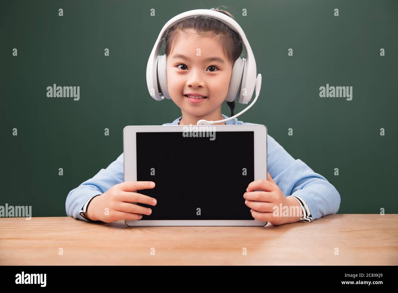 Primary school girls online learning Stock Photo - Alamy