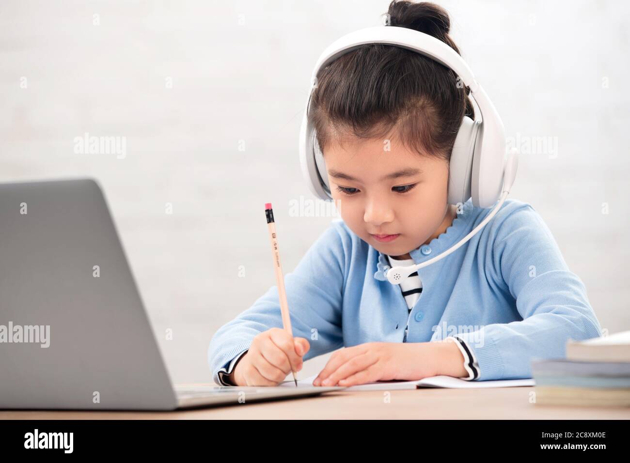 Primary school girls online learning Stock Photo - Alamy