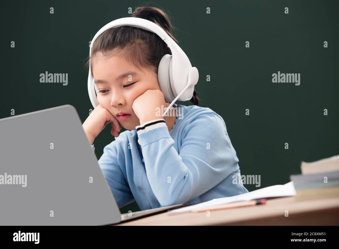 Primary school girls online learning Stock Photo - Alamy