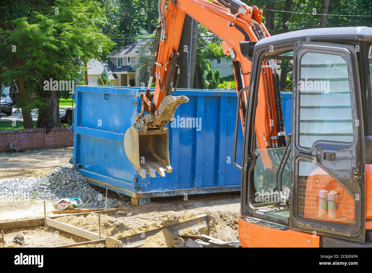 Group of excavator working on a construction site mini excavator and ...