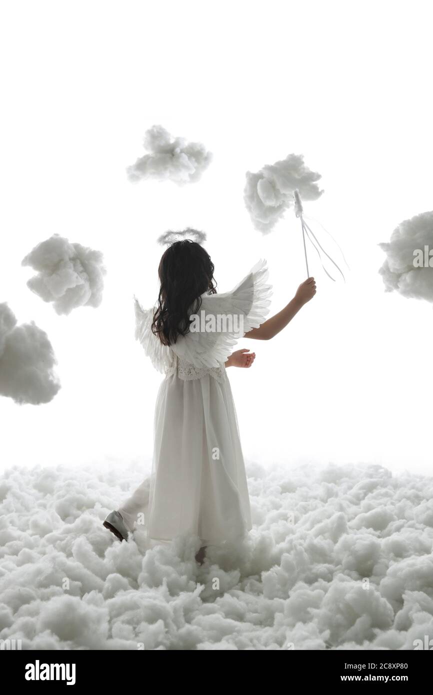 Holding a magic wand angel figure Stock Photo - Alamy