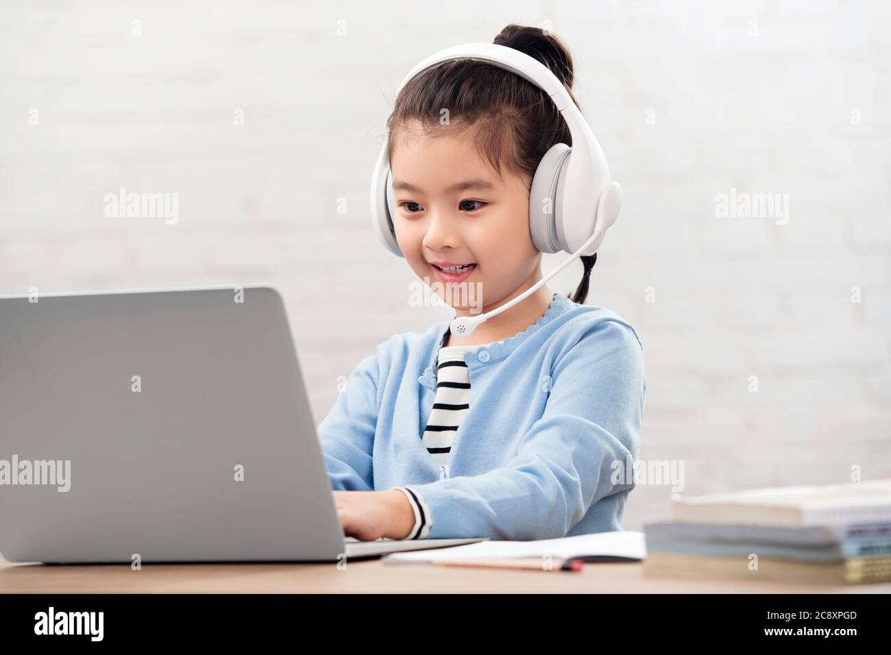 Primary school girls online learning Stock Photo - Alamy