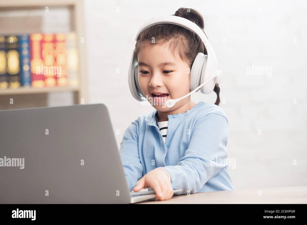 Primary school girls online learning Stock Photo - Alamy