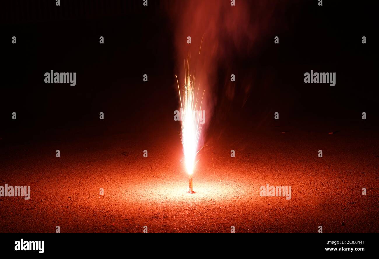 fountain firework stream into dark night Stock Photo - Alamy