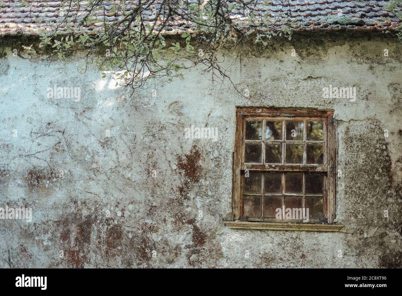Old building with a rusted wooden window Stock Photo - Alamy