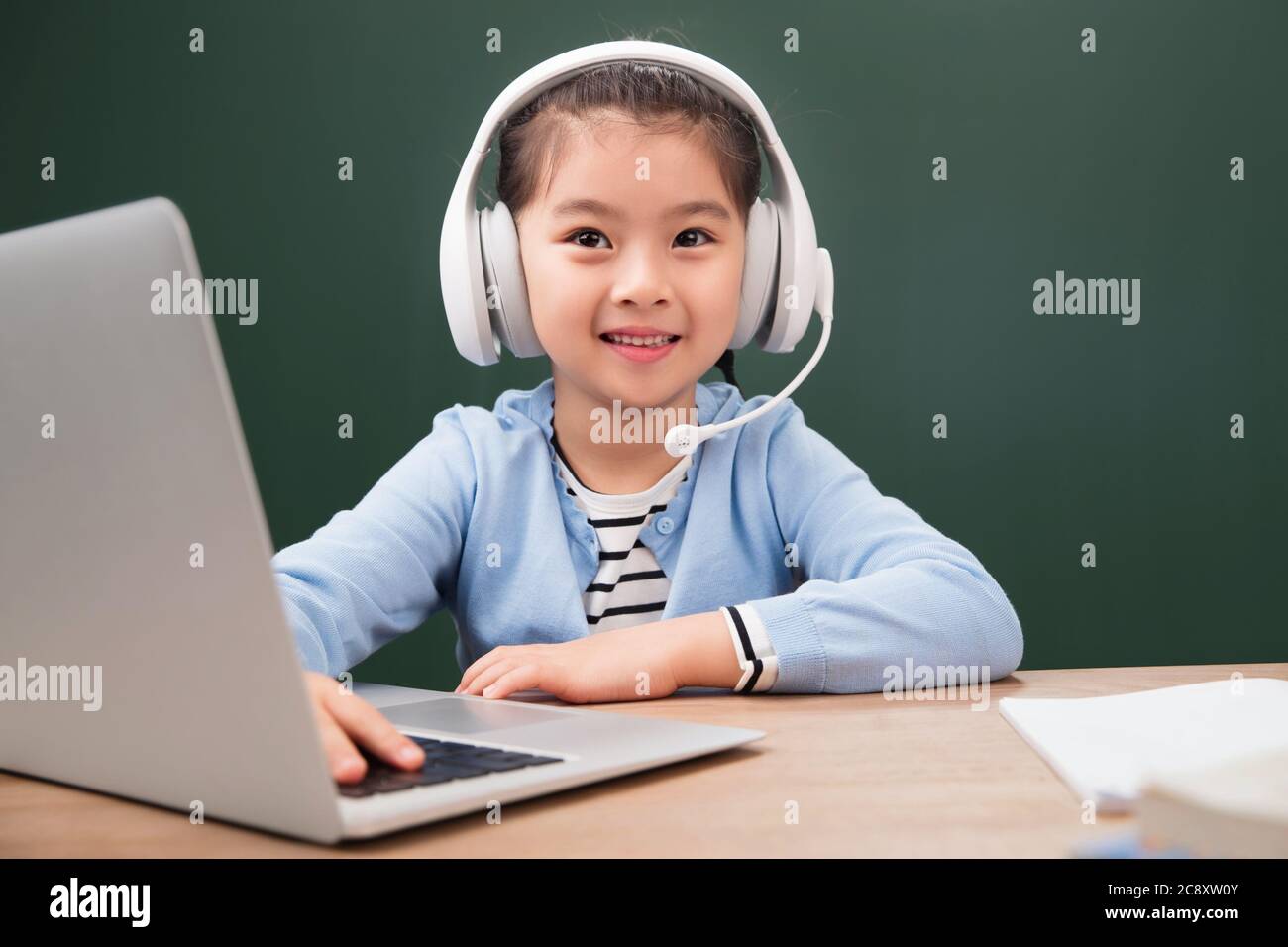 Primary school girls online learning Stock Photo - Alamy