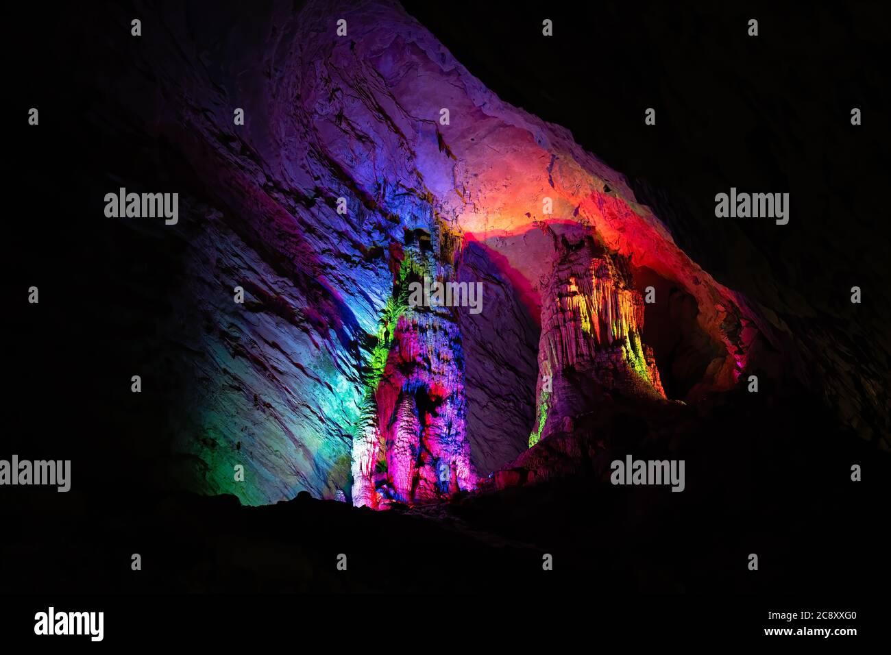 illuminated with the colorful lights stalactites and stalagmites inside ...